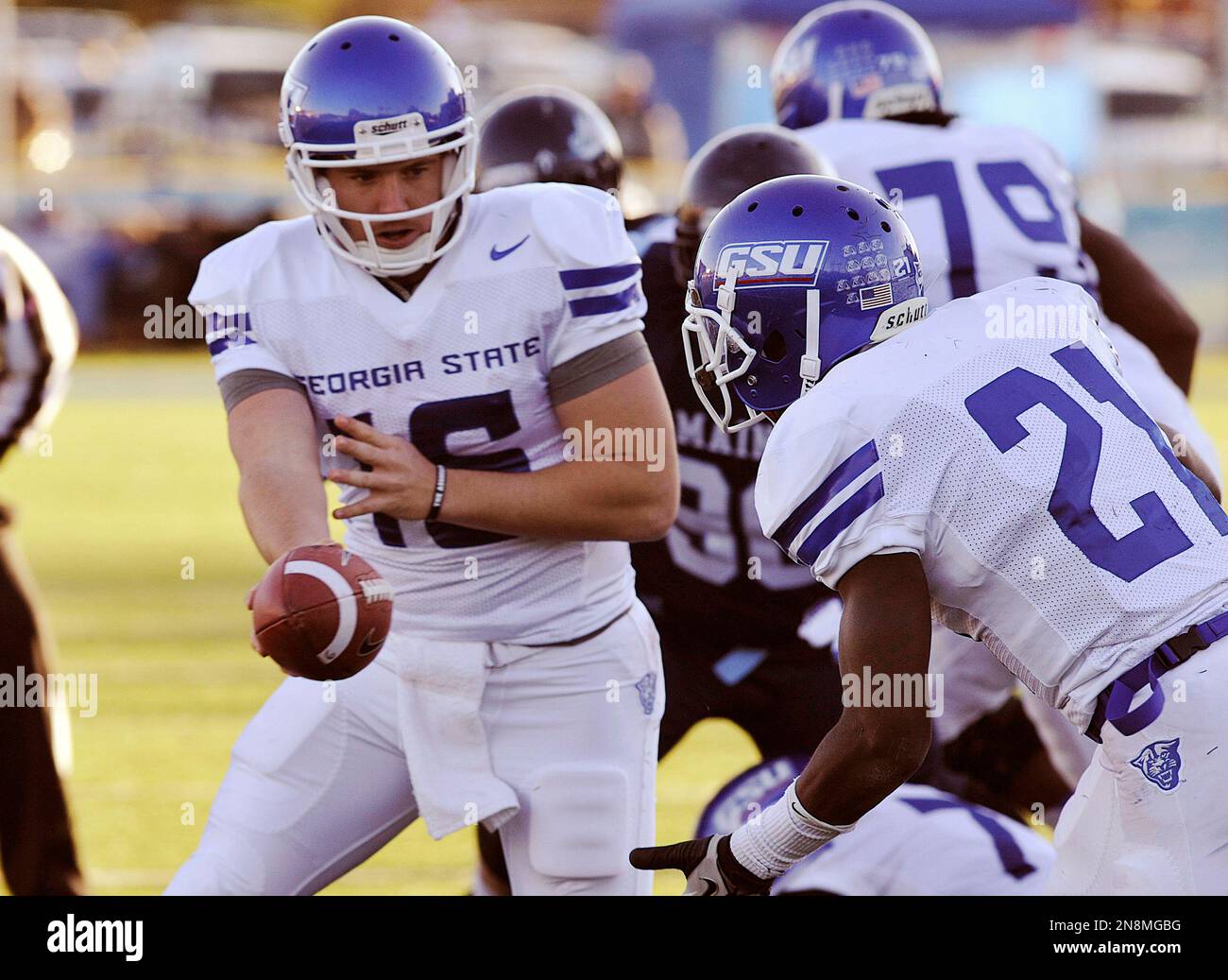 Georgia State quarterback Ben McLane (16) hands off to running back ...