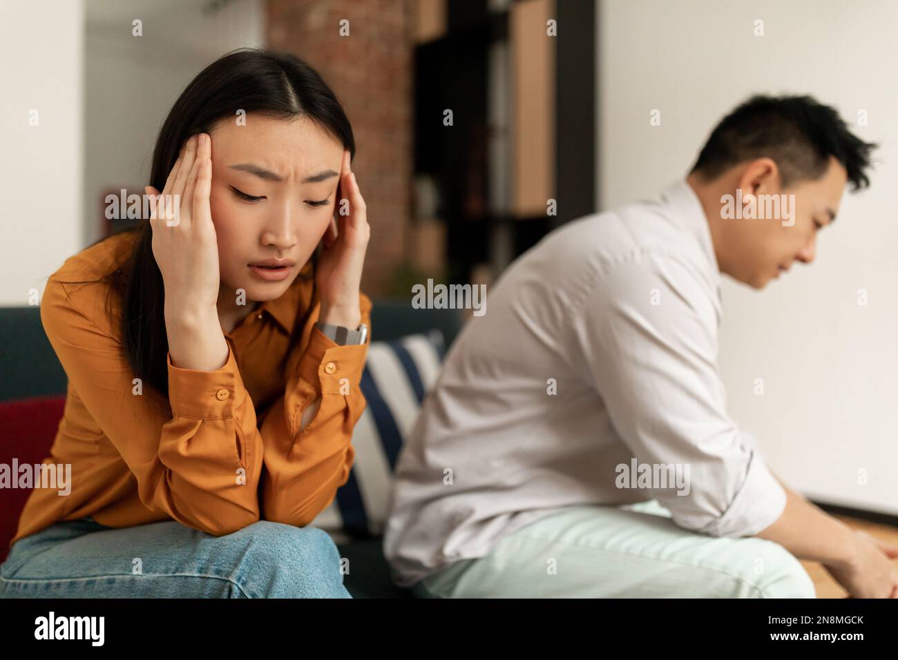 Unhappy young asian woman crying after quarrel with husband, korean ...