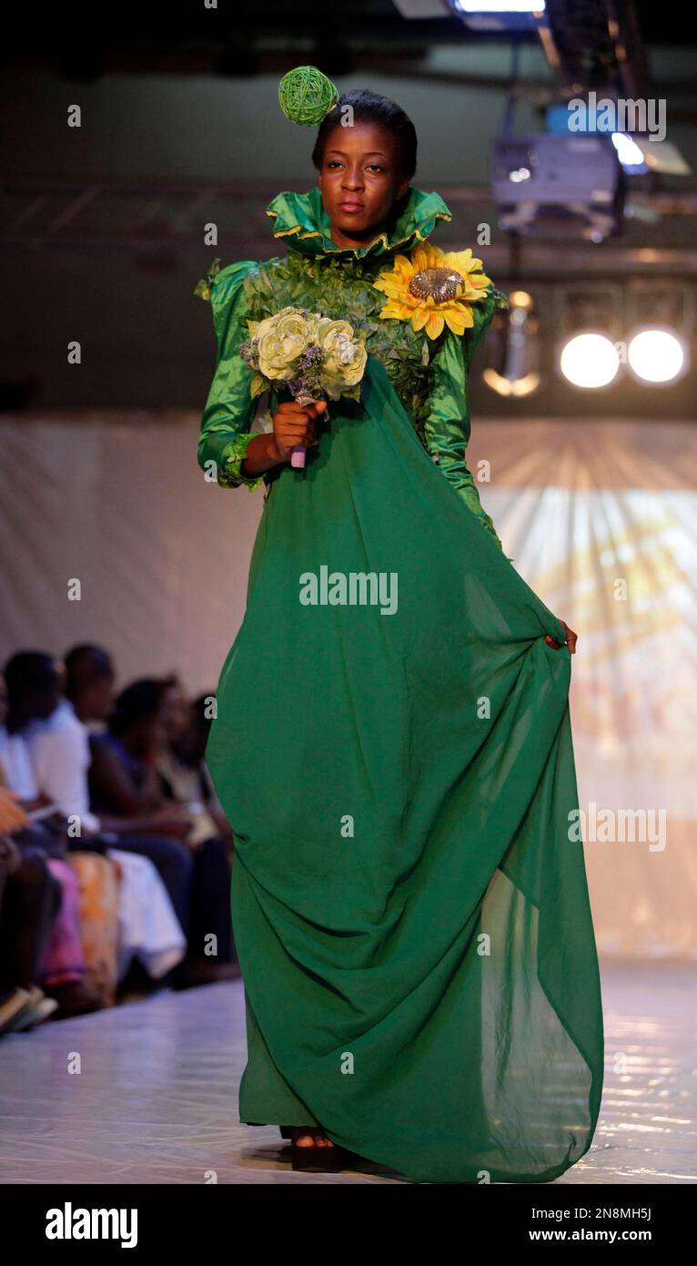 A model displays an outfit by Modela Couture, during a fashion show, as ...