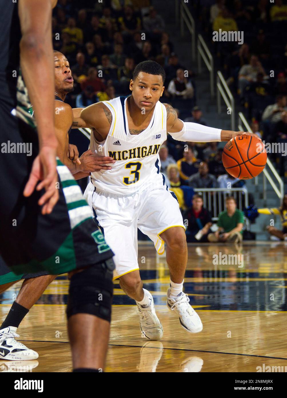 Michigan guard Trey Burke (3) dribbles the ball in the first half of an ...