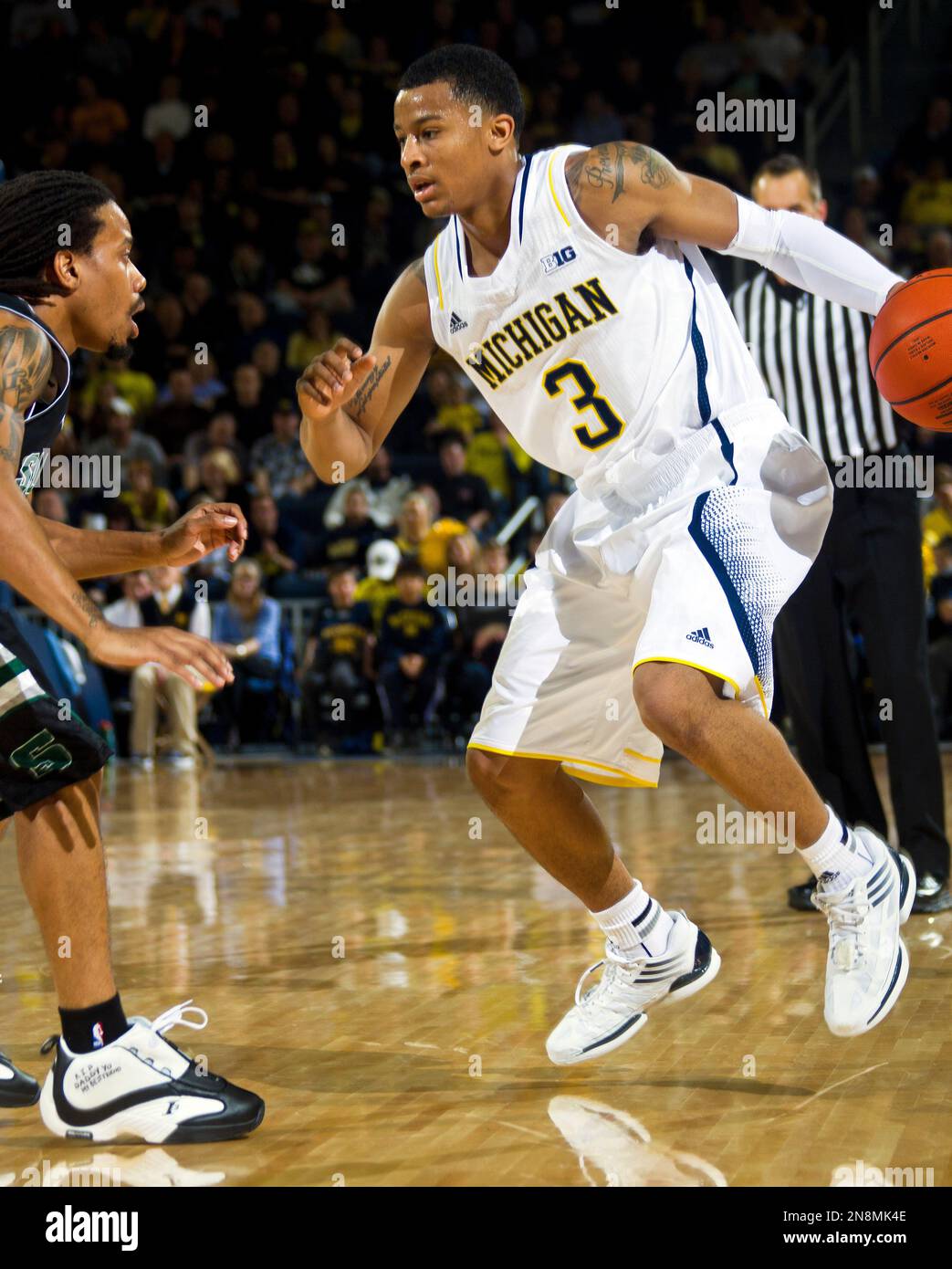 Slippery Rock guard Sa'Quan Davis, left, defends Michigan guard Trey ...