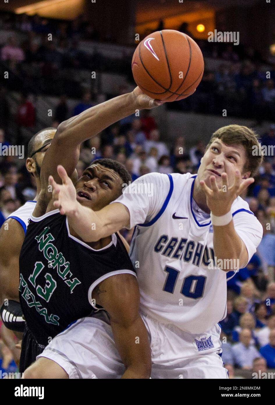 North Texas' Tony Mitchell (13) and Creighton's Grant Gibbs (10) battle ...