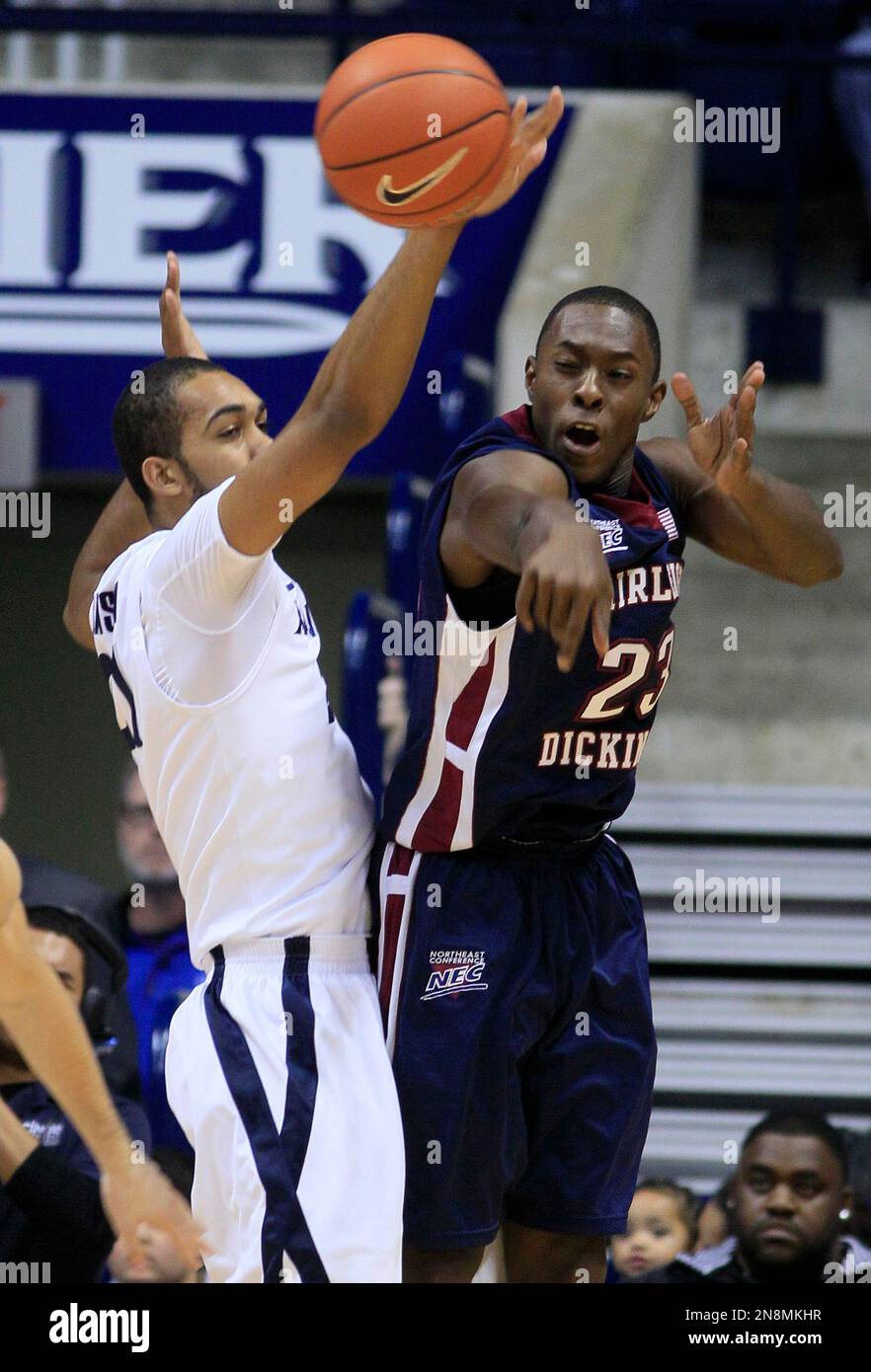 Fairleigh Dickinson guard Lonnie Robinson (23) passes around Xavier ...