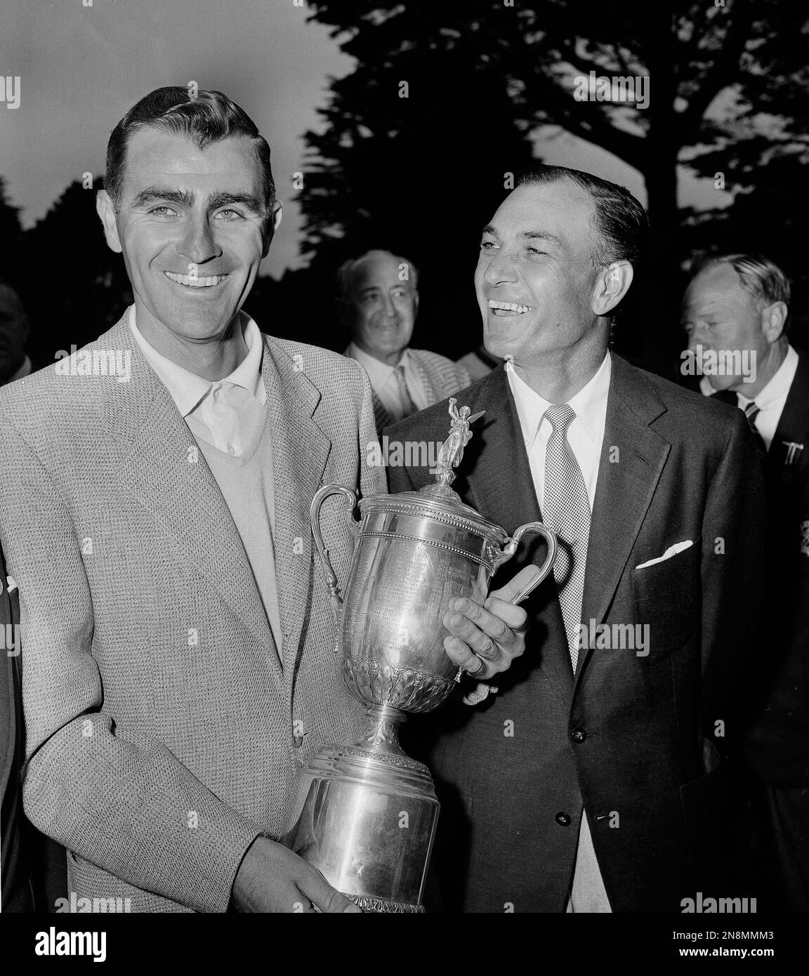 Jack Fleck, young pro from Davenport, Iowa, holds trophy he won by ...