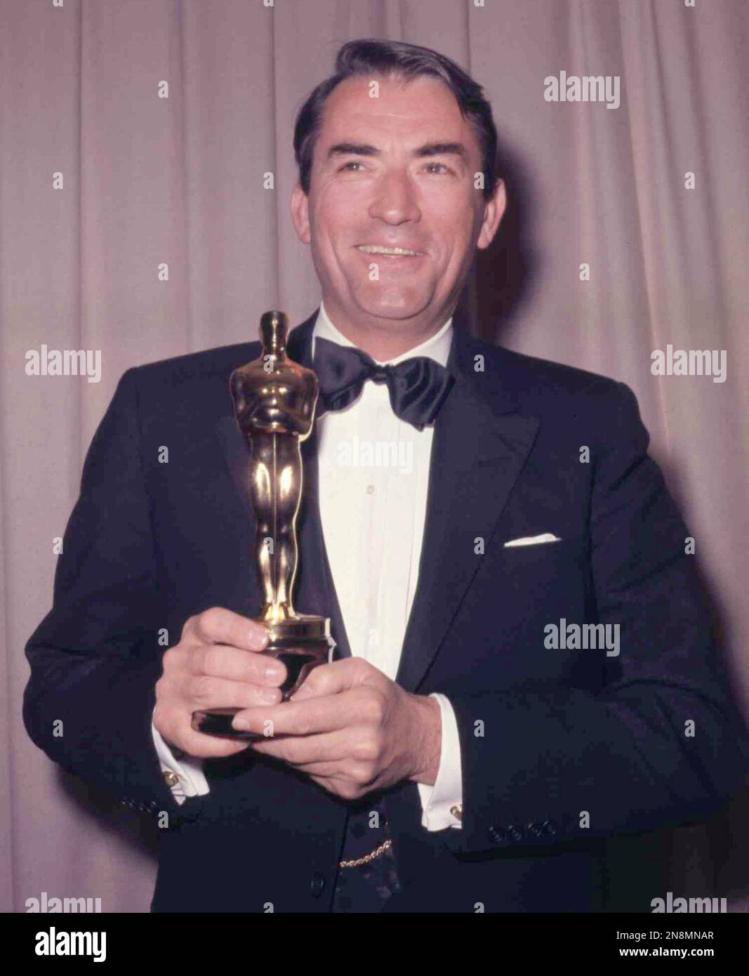 American actor Gregory Peck with his Oscar after winning his first ...