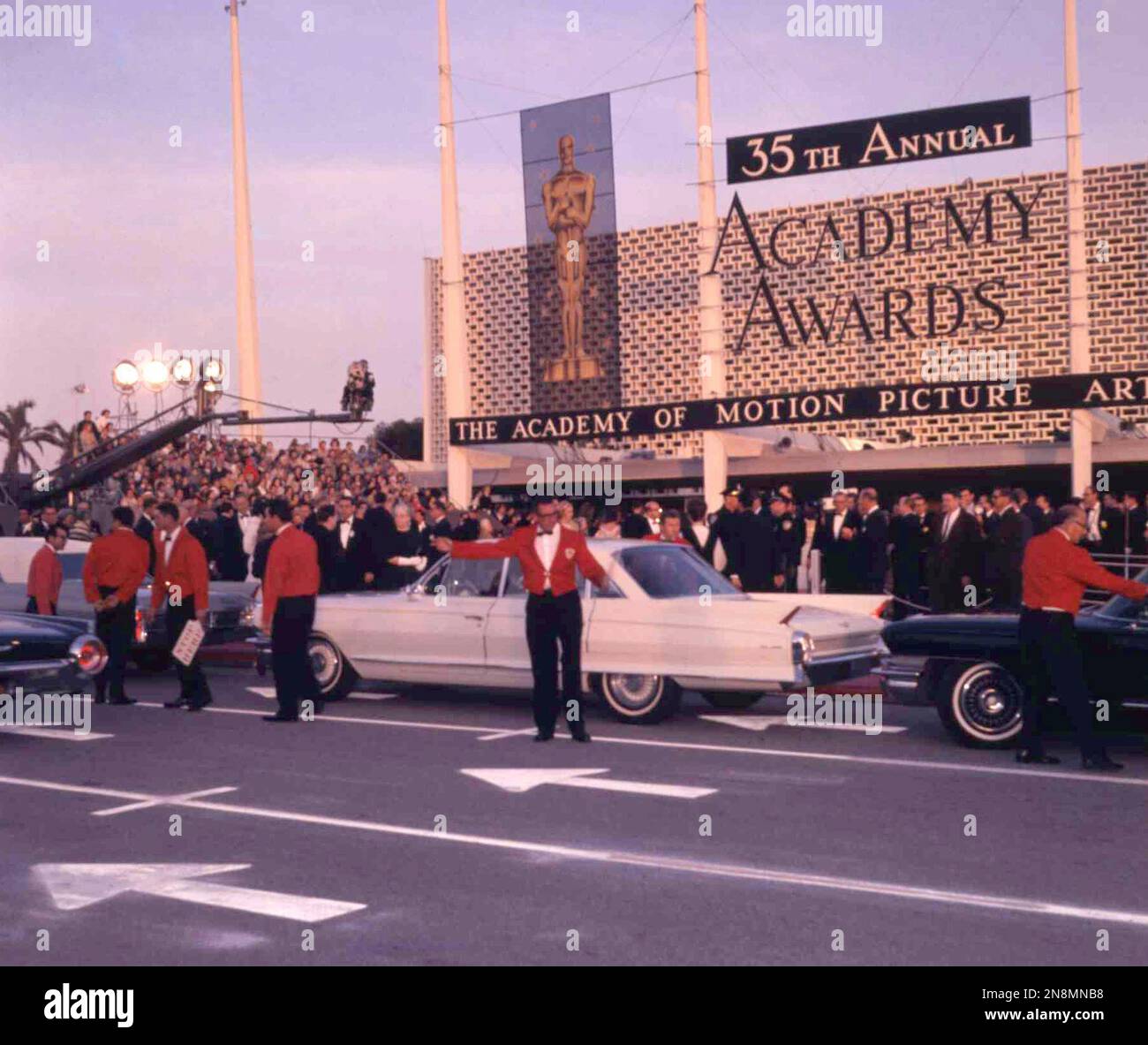 Fans in bleachers watch guests arriving in their cars for the 35th ...