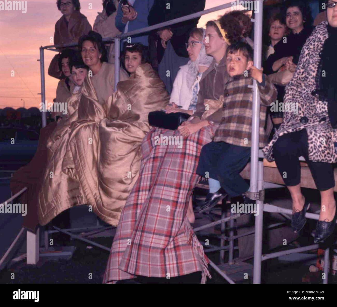 Fans in bleachers watch guests arriving in their cars for the 35th ...