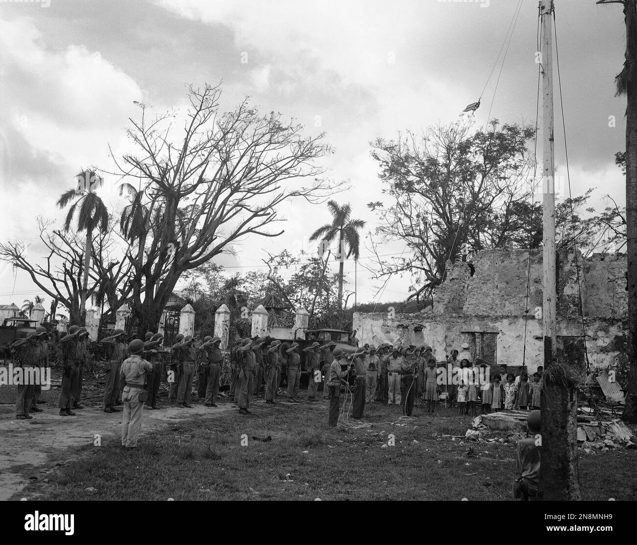 With indigenous people of Guam and American officers and men in ...