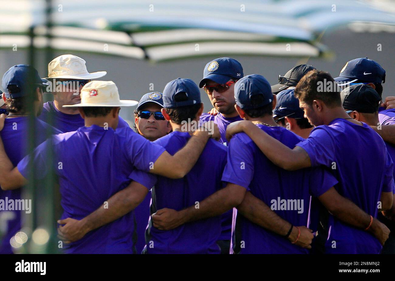 India's Sachin Tendulkar, center left facing camera, huddles with ...