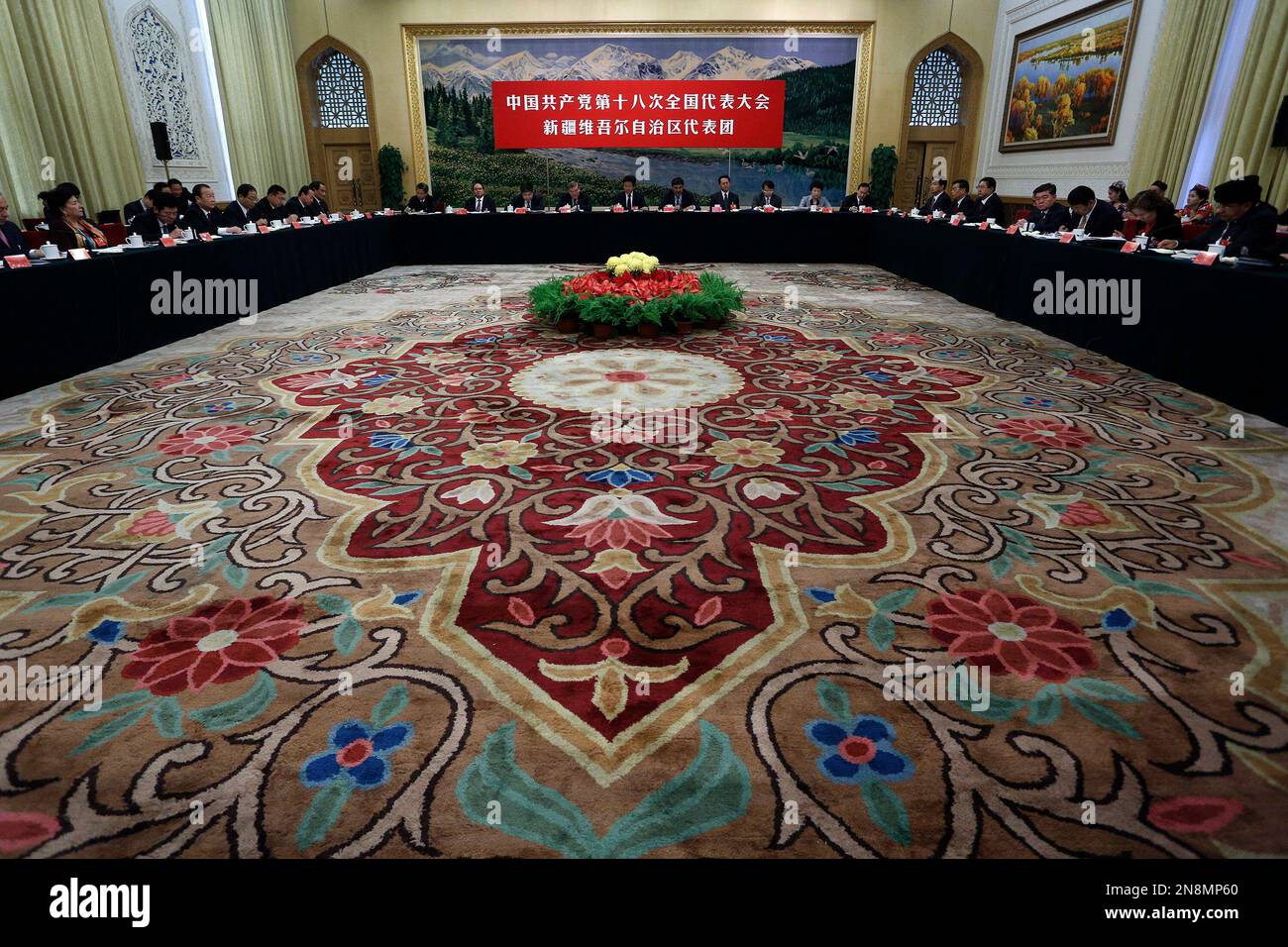Delegates from China's Xinjiang Uygur Autonomous Region attend a ...