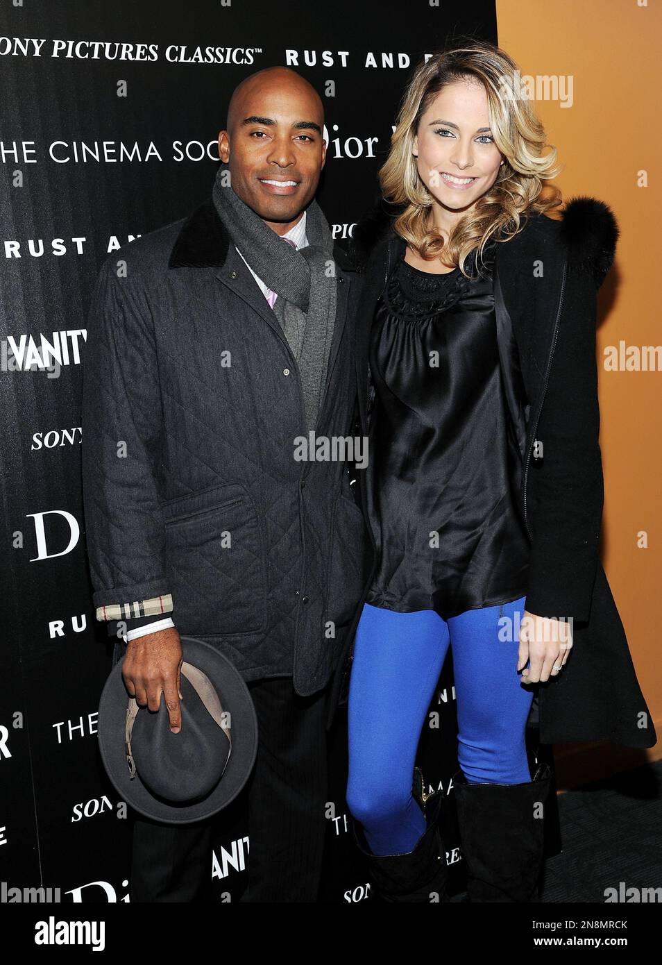 Tiki Barber and fiancÈe Traci Lynn Johnson attend a special screening ...