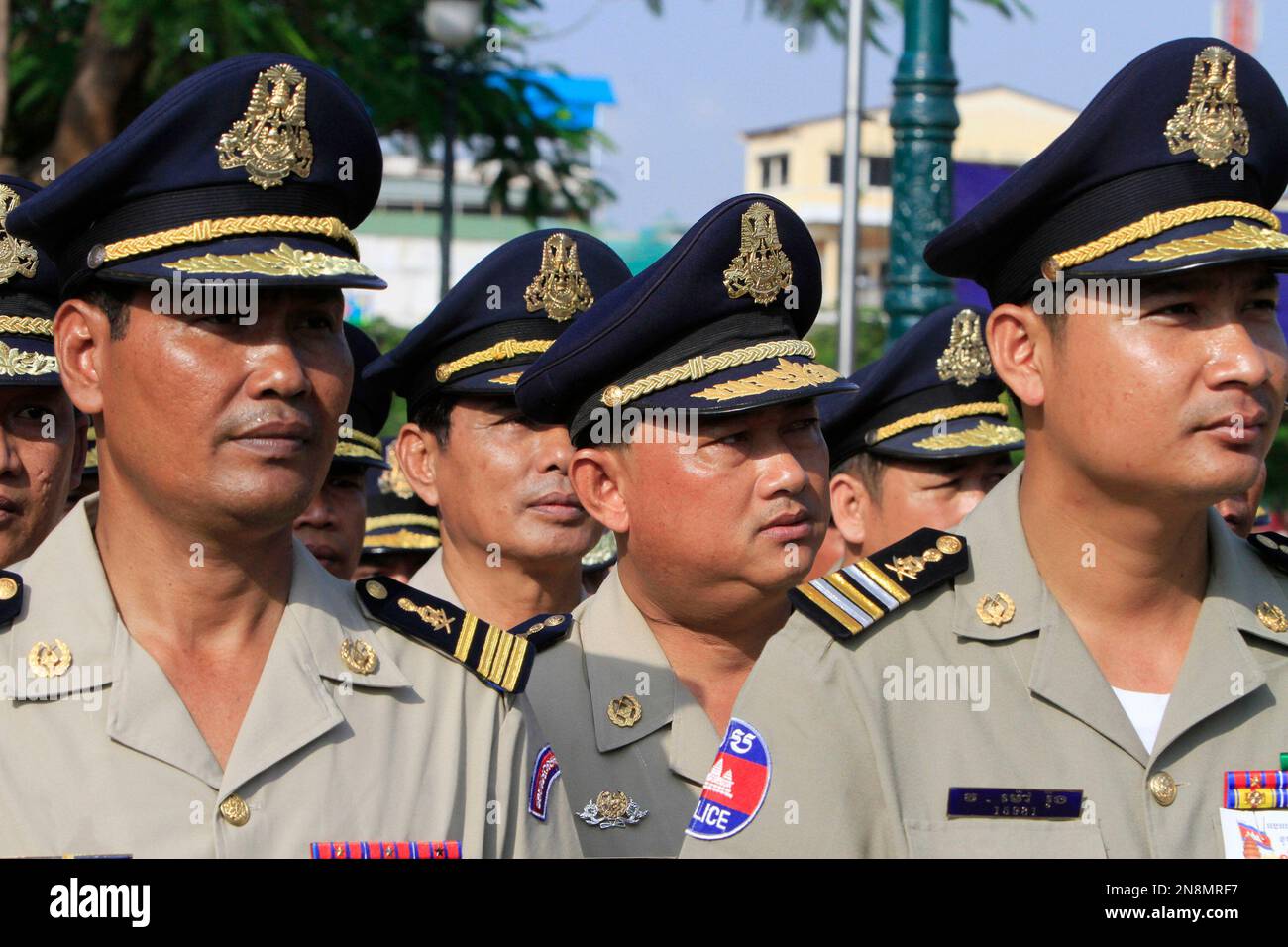 Cambodian police officers participate in a ceremony to celebrate the ...