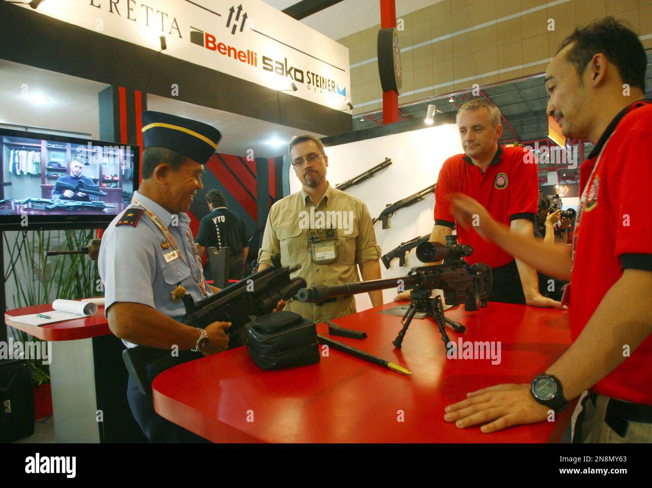 An Indonesian Air Force officer takes a closer look at an Italian-made ...