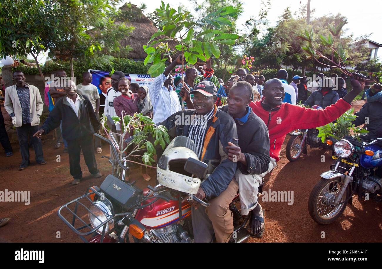 Villagers ride motorcycles and wave branches to celebrate Obama's re ...