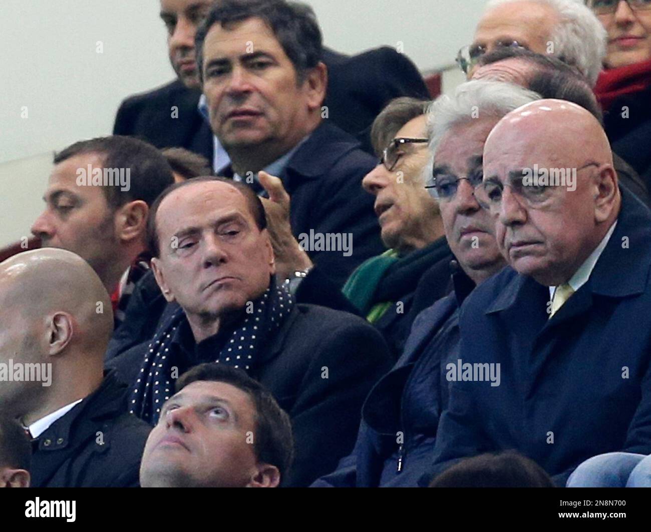 AC Milan President Silvio Berlusconi, left, sits next to businessman ...
