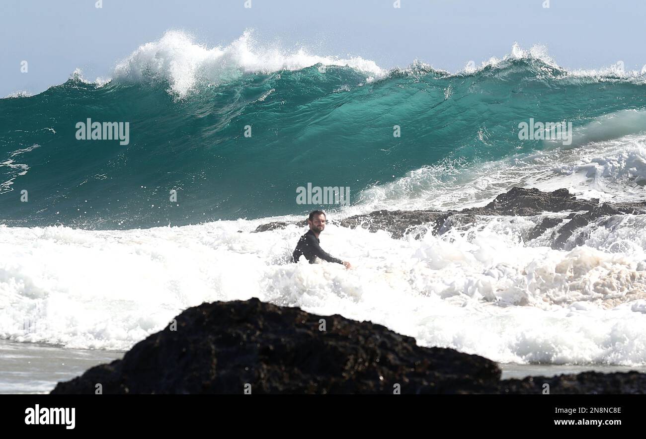 Surfers are seen at Snapper Rocks on the Gold Coast , Sunday, February ...