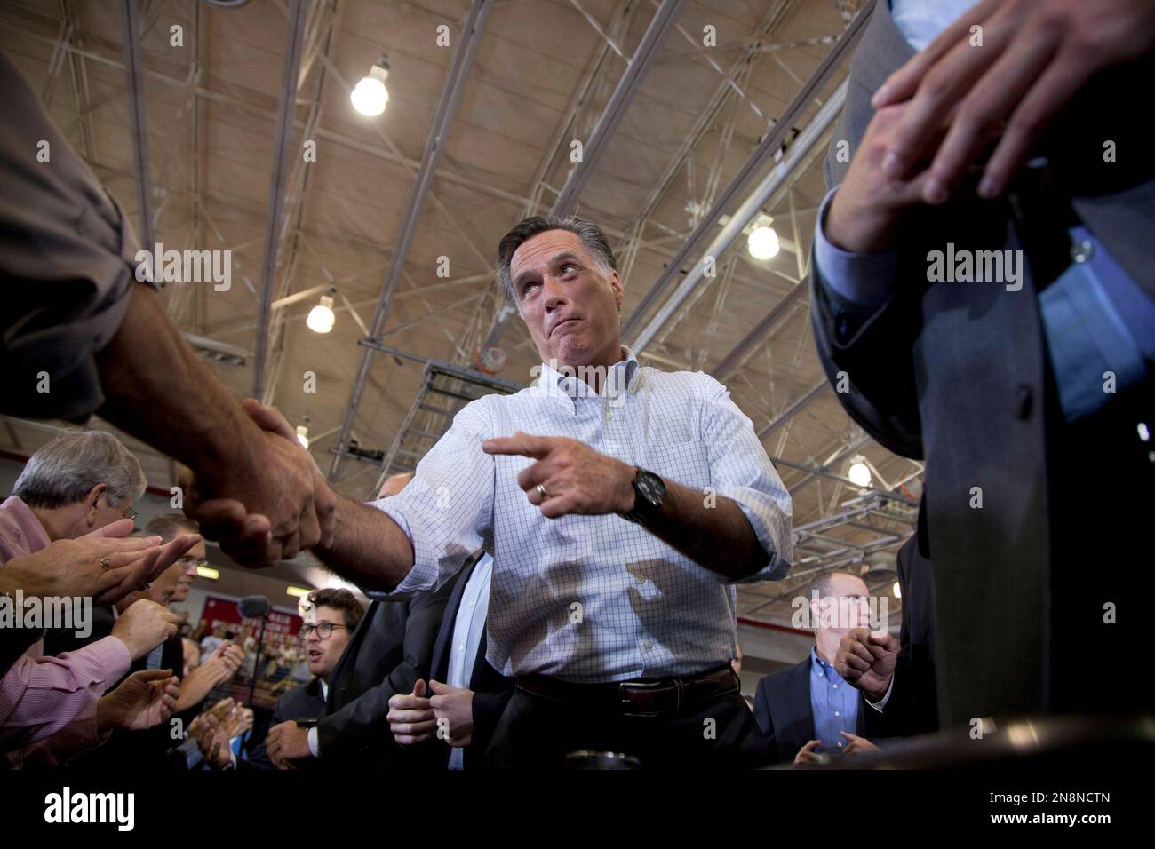 In this Sept. 7, 2012 file photo, Mitt Romney shakes hands during a ...