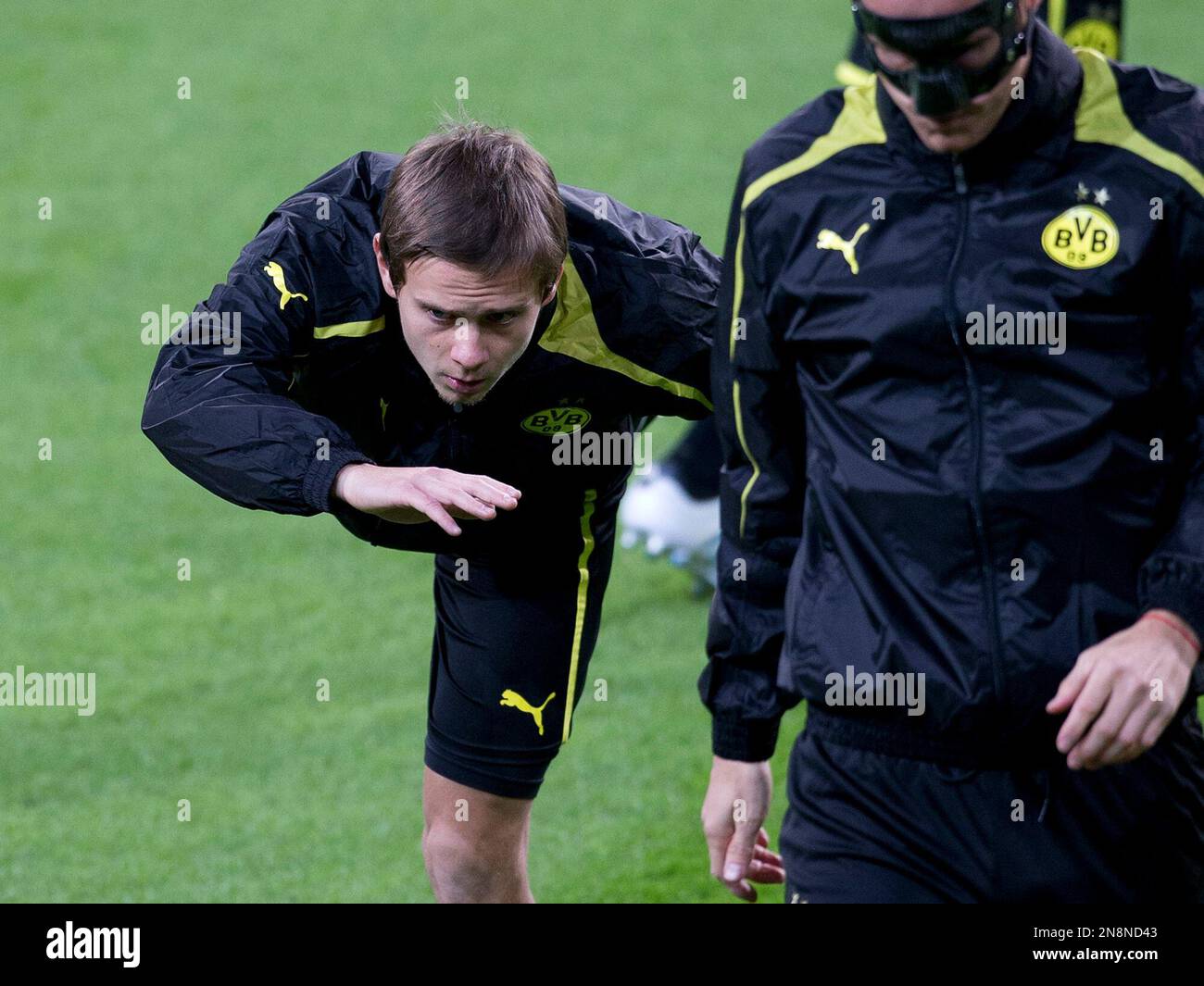 Borussia Dortmund's Chris Lowe, left exercises next to Sebastian Kehl ...