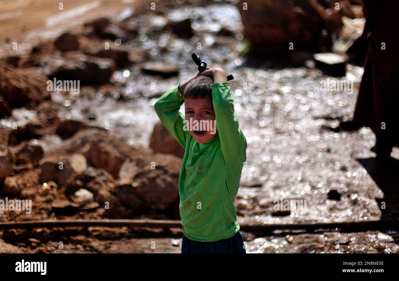 A Syrian boy who fled with his family from the violence in their ...