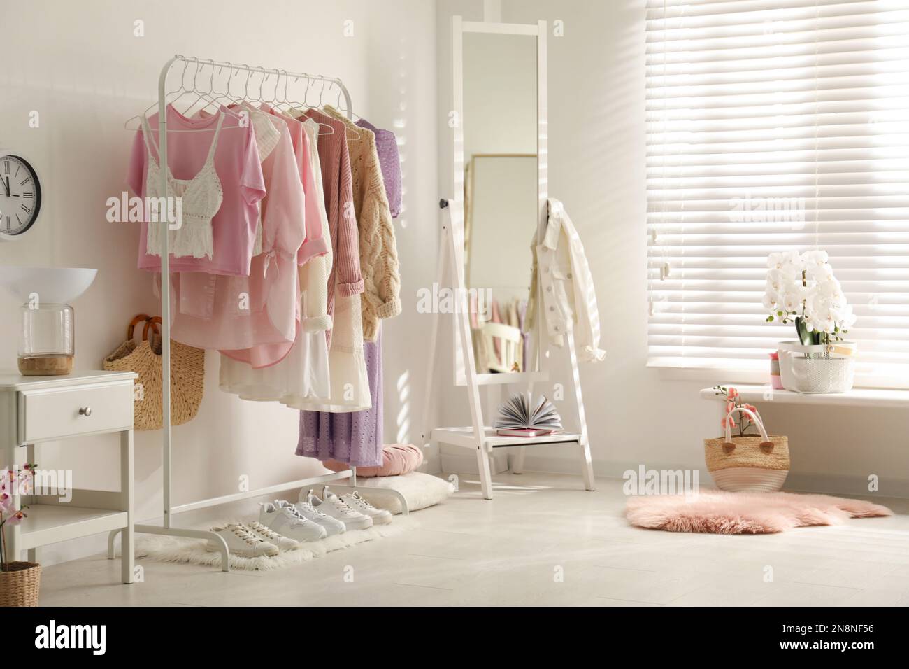 Dressing room interior with clothing rack and mirror Stock Photo - Alamy