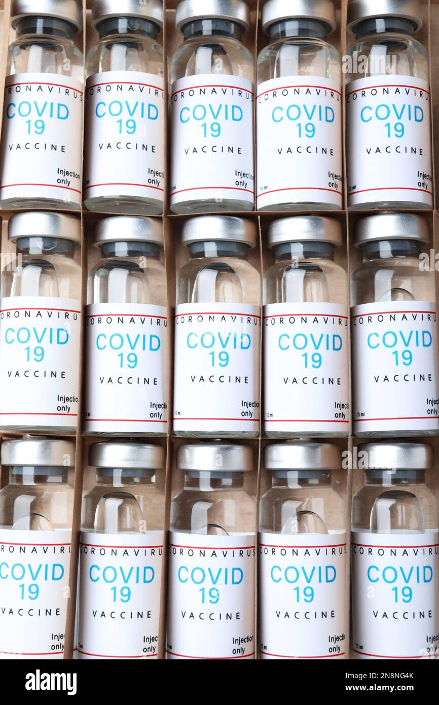 Glass vials with COVID-19 vaccine in package, top view Stock Photo - Alamy