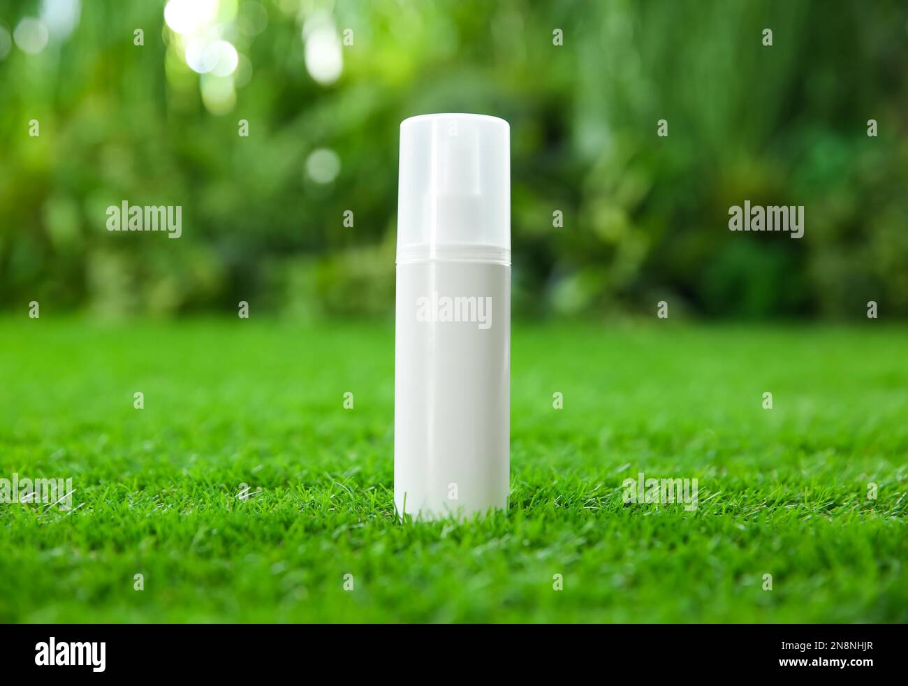 Bottle of insect repellent spray on green grass Stock Photo - Alamy