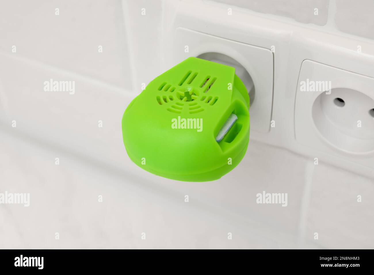 Electric mosquito device with insect repellent plate plugged in socket ...