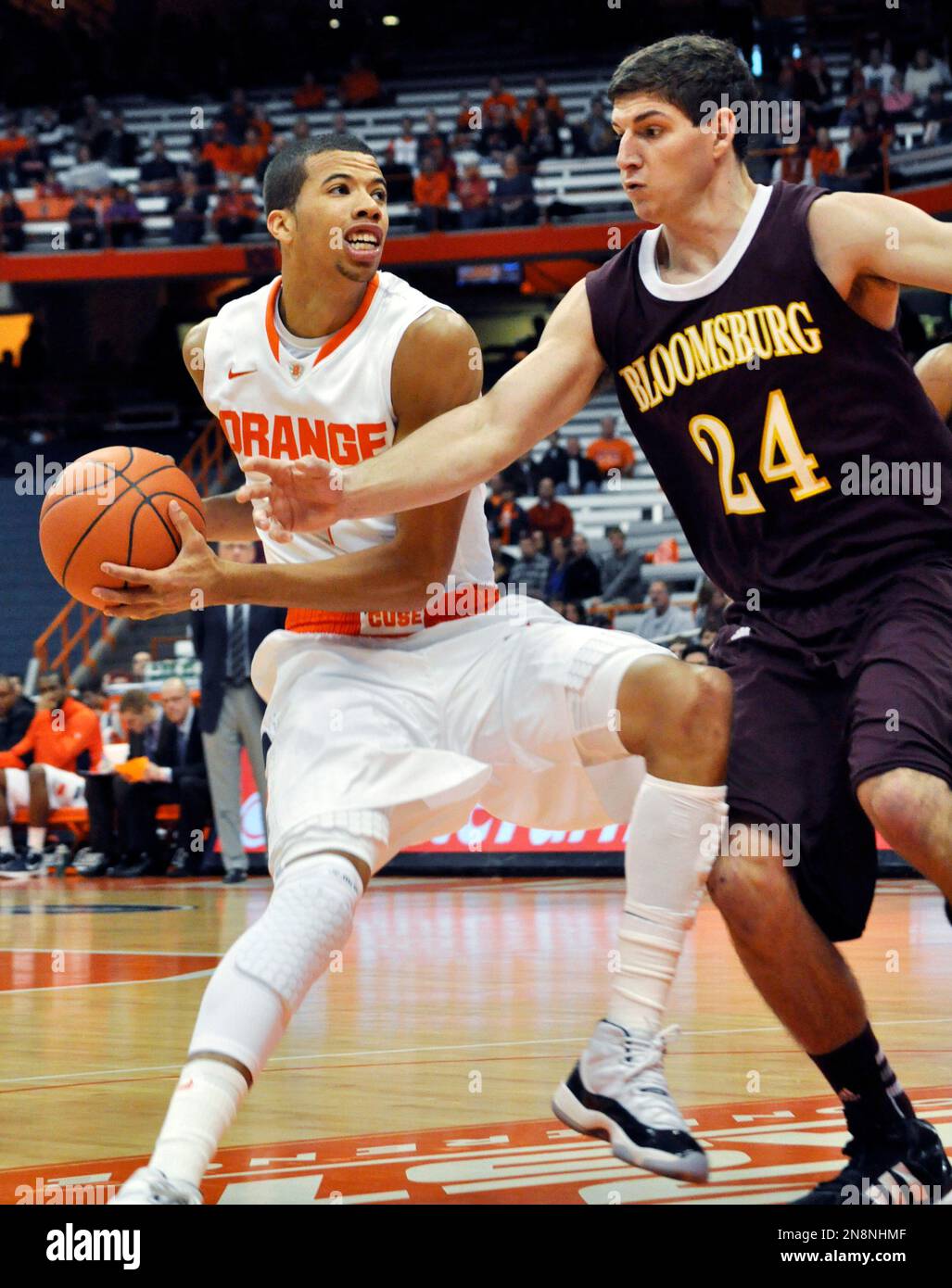 Syracuse's Michael Carter-Williams, left, drives against Bloomsburg's ...