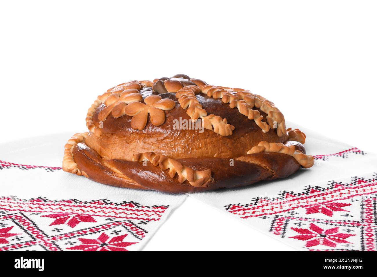 Rushnyk with korovai on white background. Ukrainian bread and salt ...