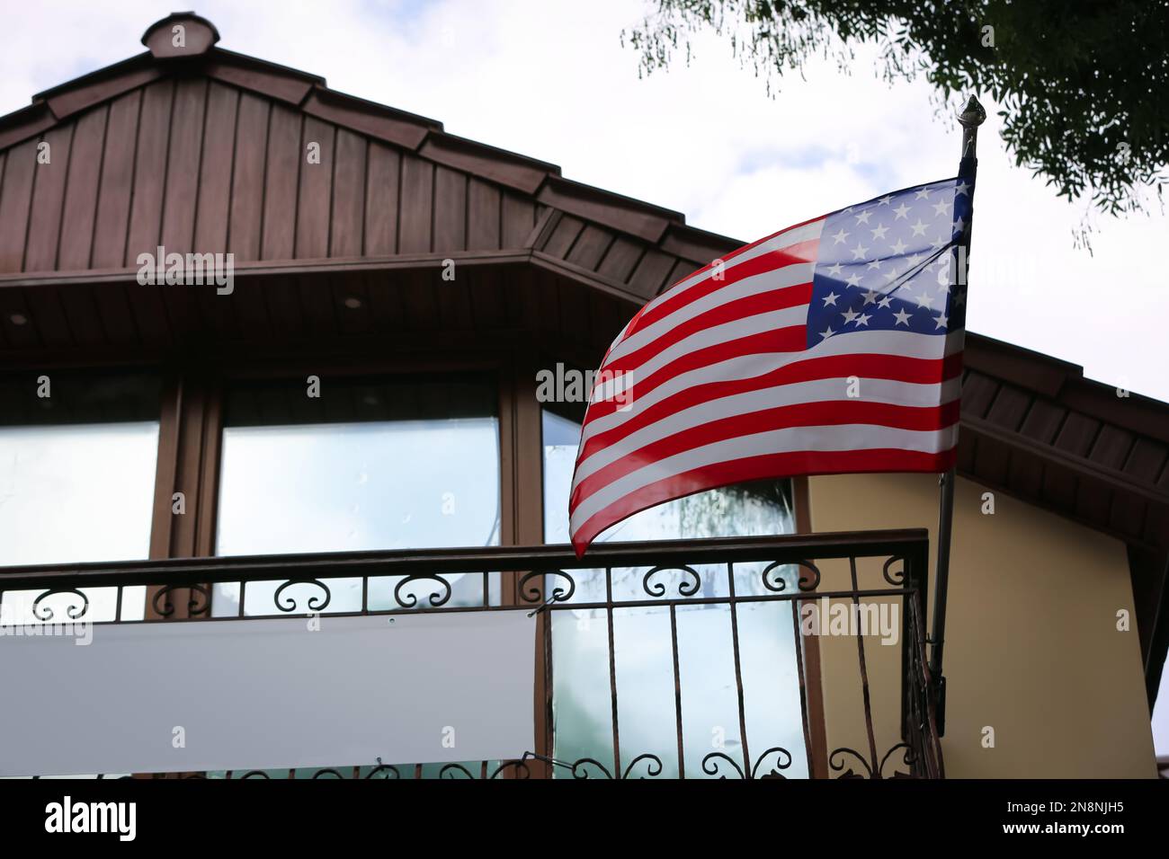 National flag of USA on building facade Stock Photo - Alamy