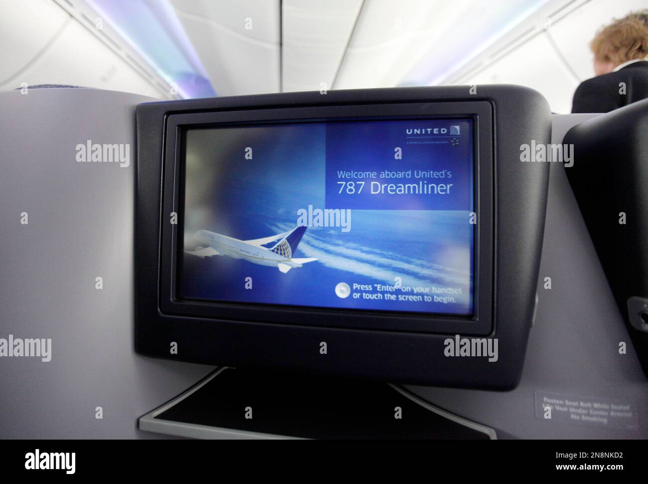 An upgraded video screen on the back of a seat of United Airlines' new ...