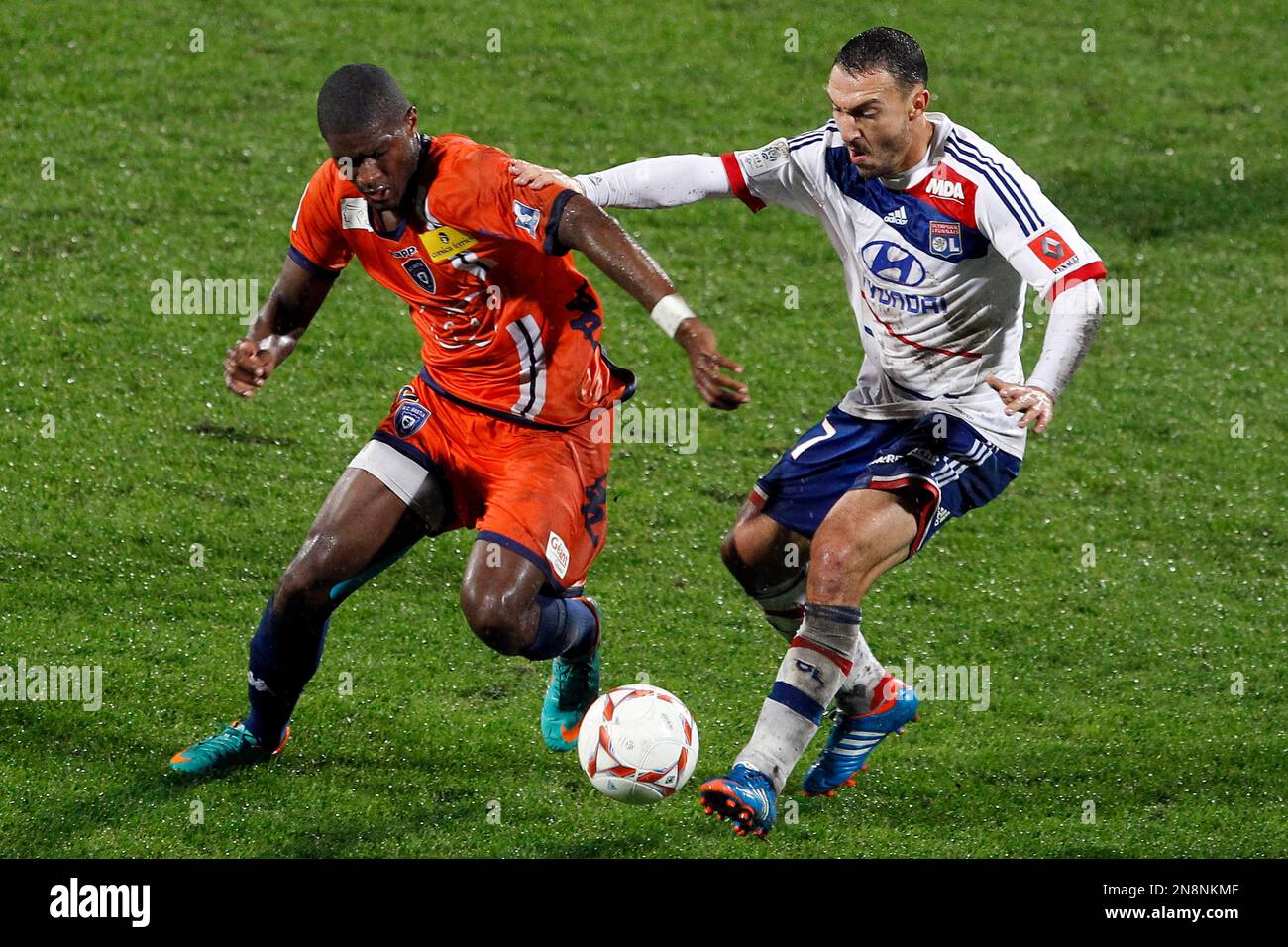 Lyon's Steed Malbranque, right, challenges for the ball with Bastia's ...