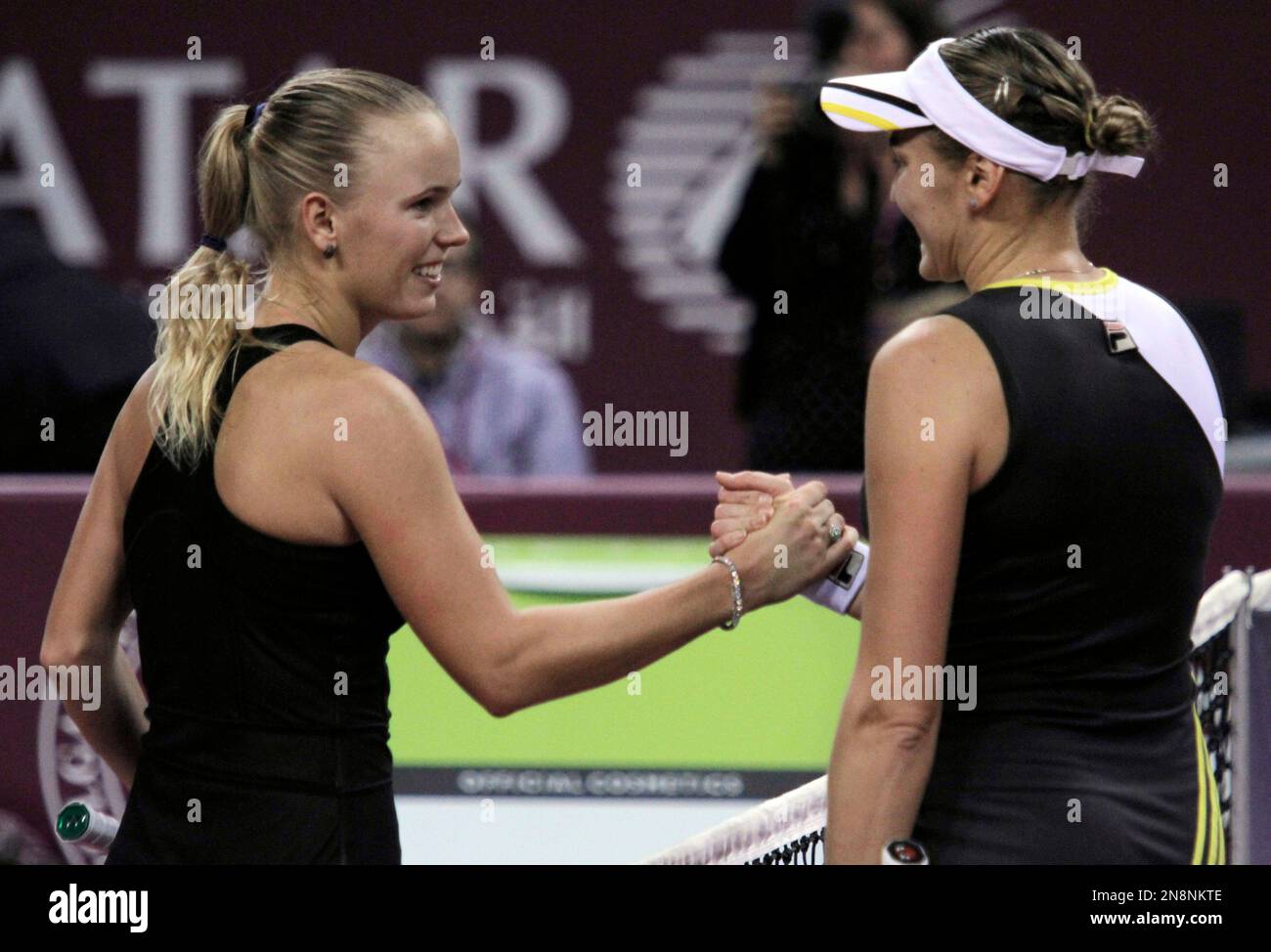 Nadia Petrova of Russia, right, shakes hands with Caroline Wozniacki of ...