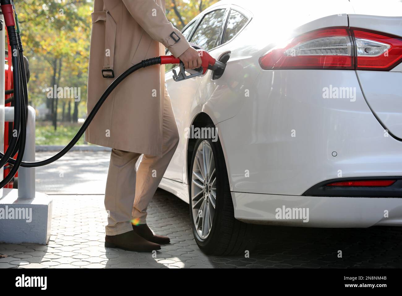 Man refueling car at self service gas station, closeup Stock Photo - Alamy