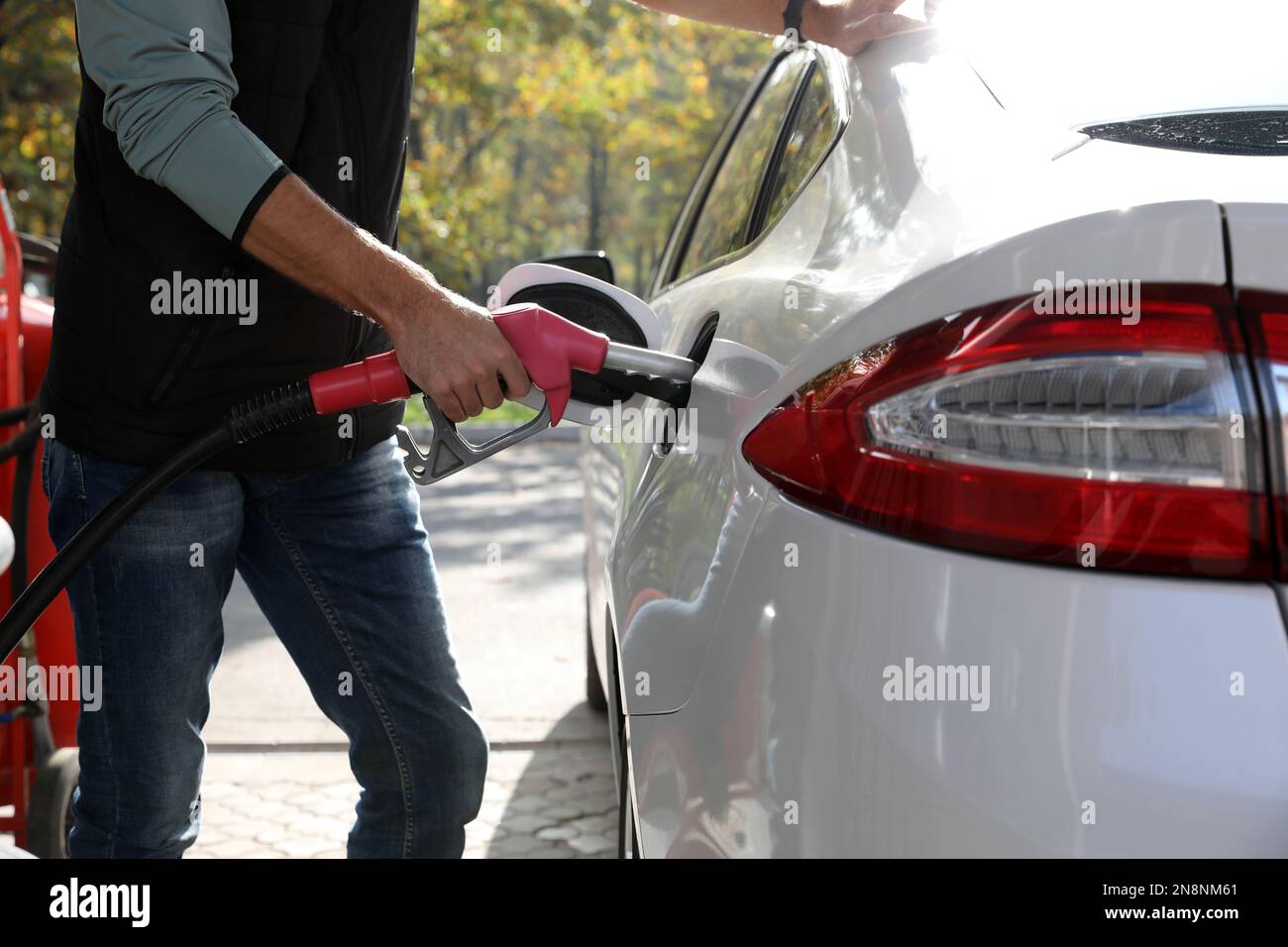 Man refueling car at self service gas station, closeup Stock Photo - Alamy