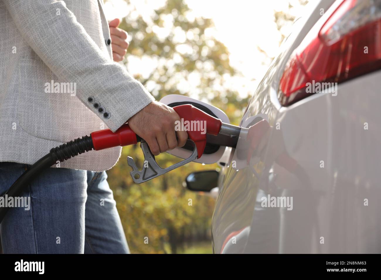Man refueling car at self service gas station, closeup Stock Photo - Alamy