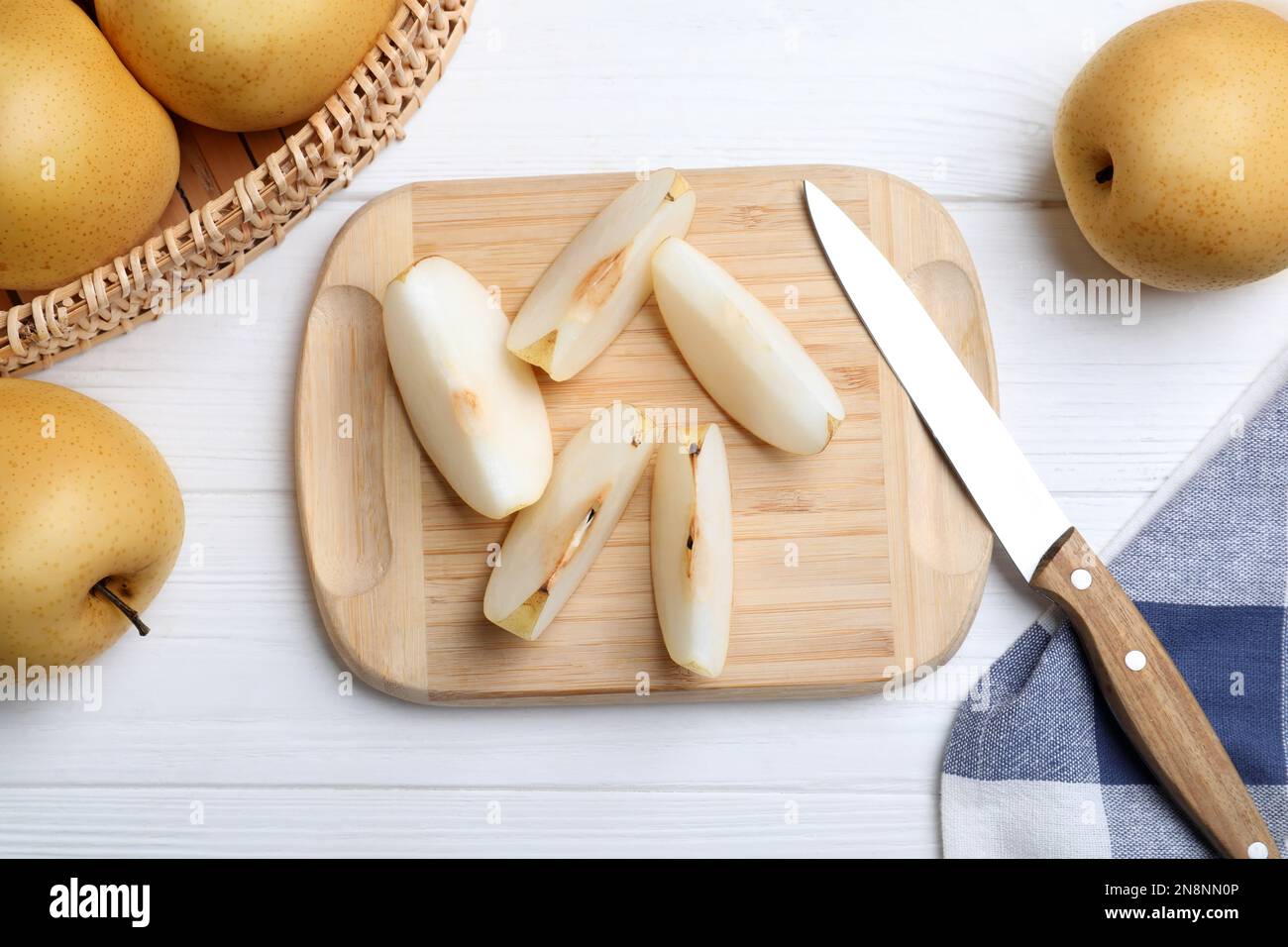 Cut and whole apple pears on white wooden table, flat lay Stock Photo ...