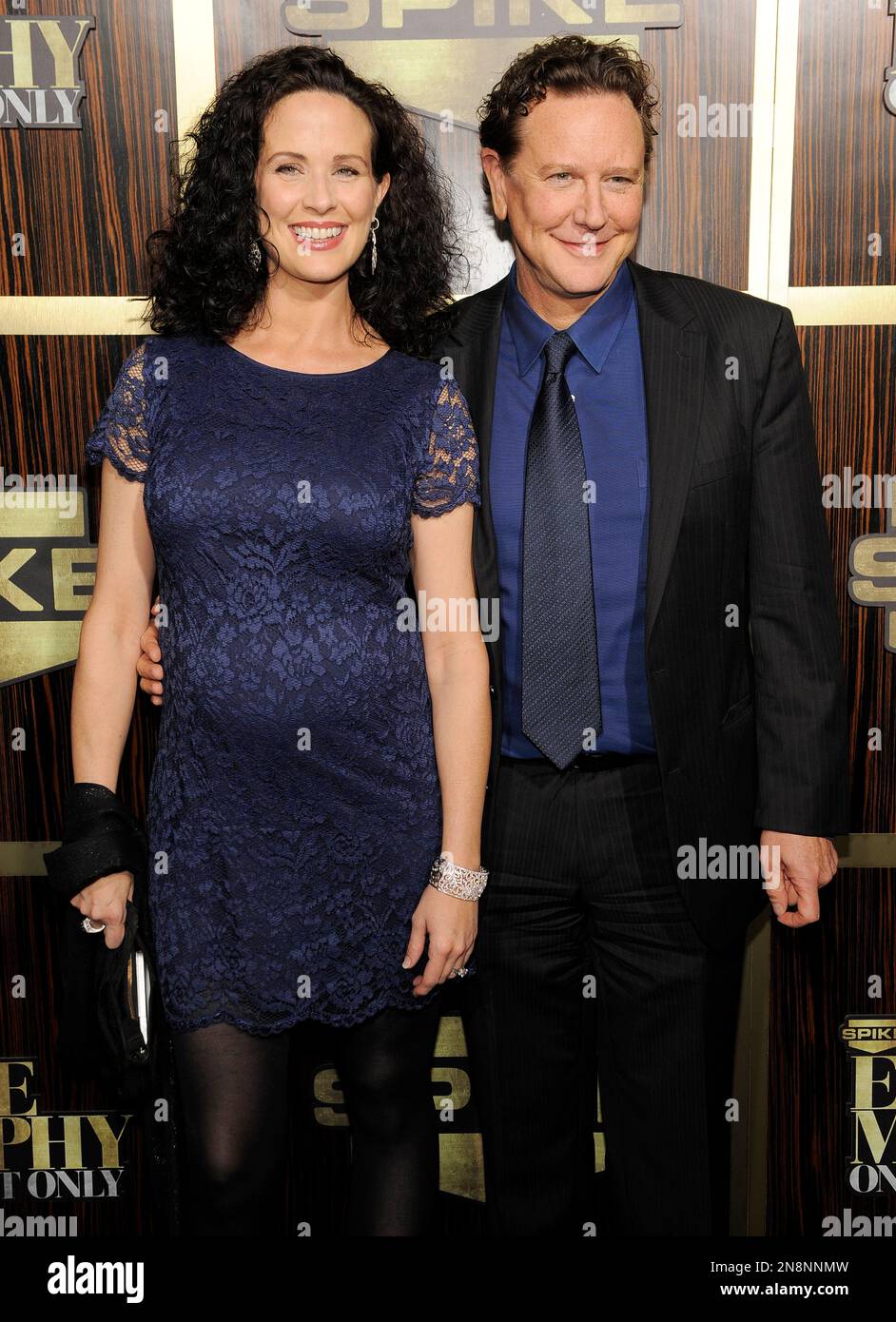 Actor Judge Reinhold and his wife Amy pose together at "Eddie Murphy ...