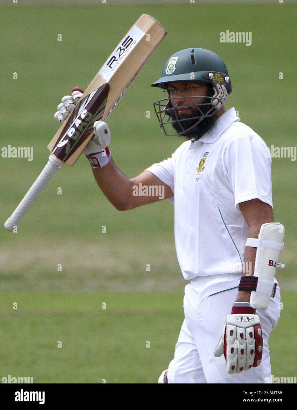 South Africa's batsman Hashim Amla raises his bat after making 50 runs ...