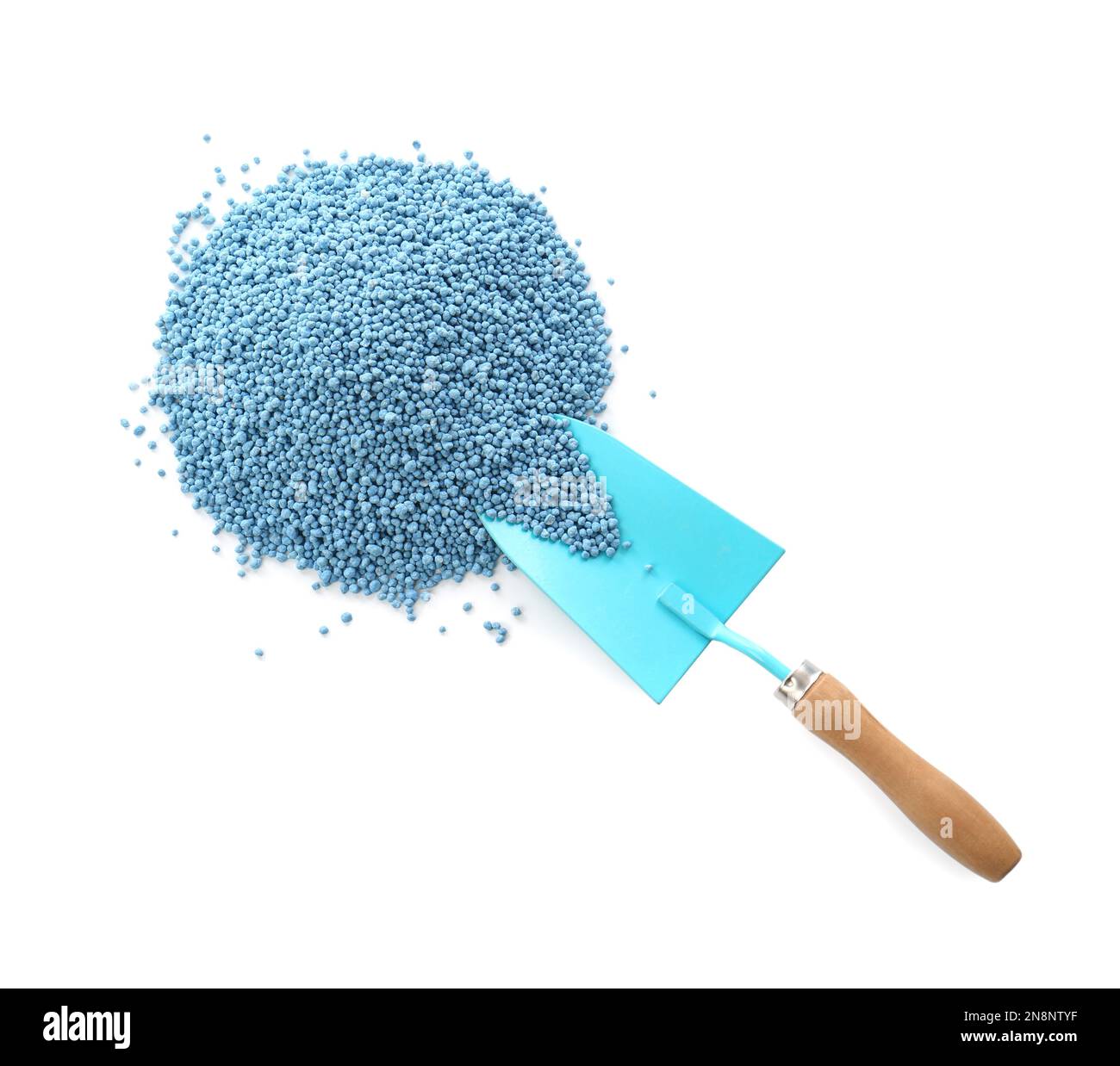Pile of granular mineral fertilizer and shovel on white background, top ...