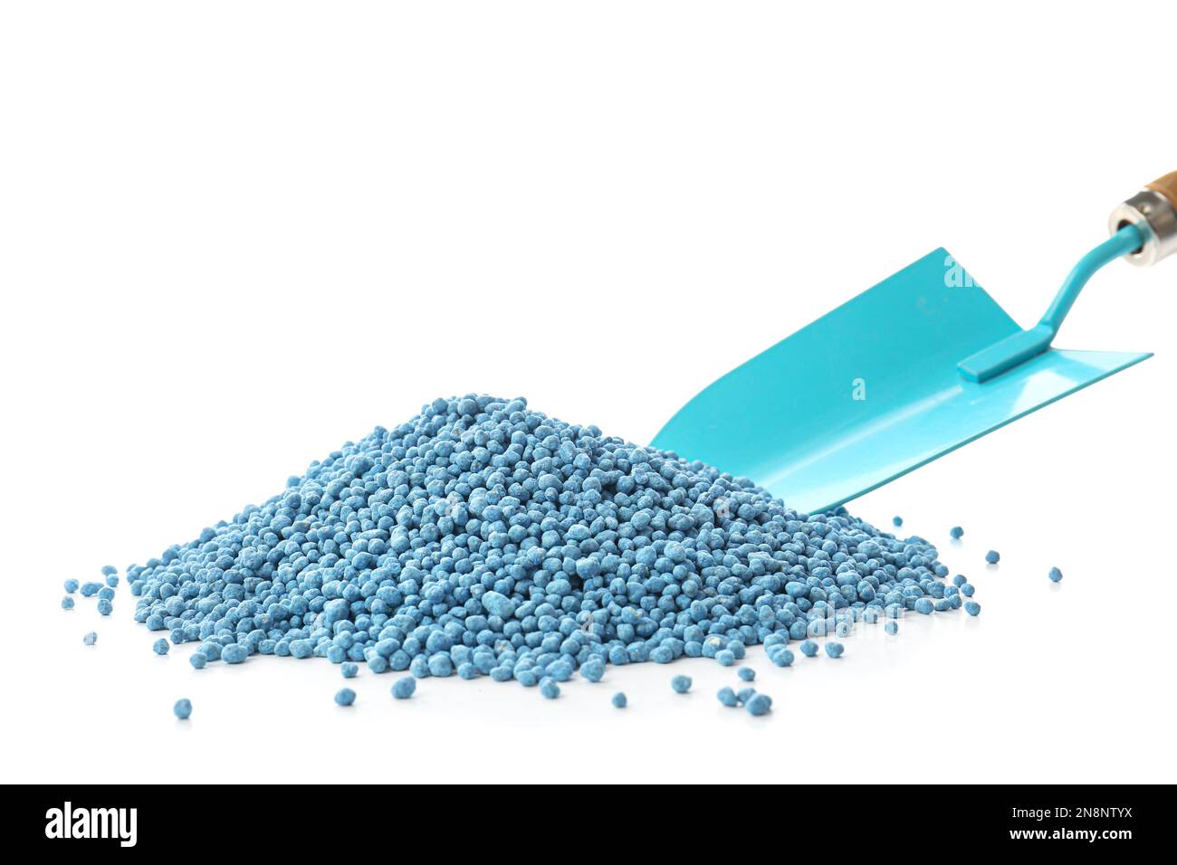 Pile of granular mineral fertilizer with shovel on white background ...
