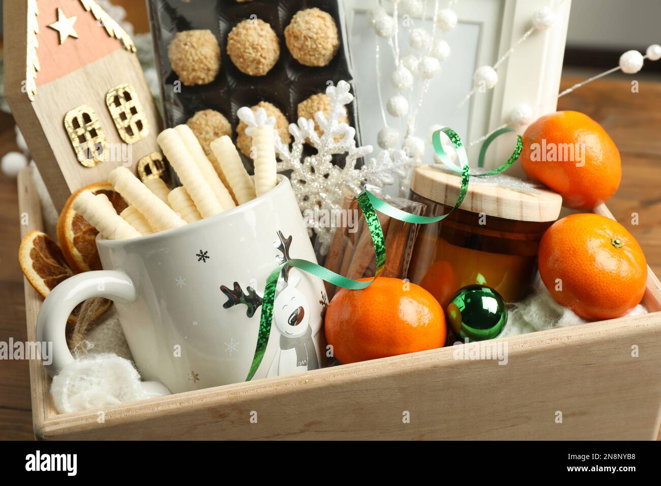 Christmas gift set in wooden crate, closeup Stock Photo - Alamy