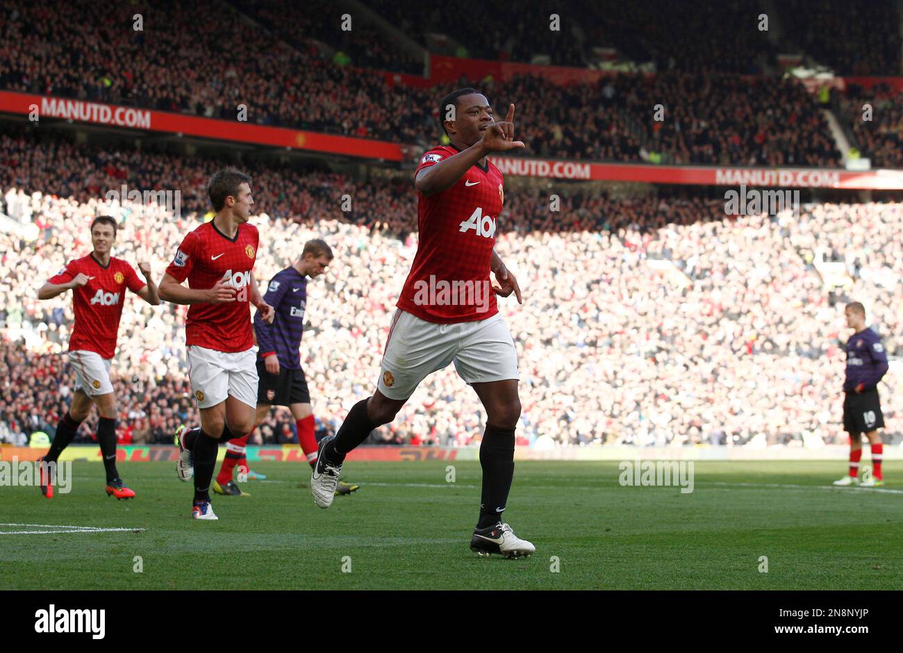 Manchester United's Patrice Evra, center, celebrates after scoring ...