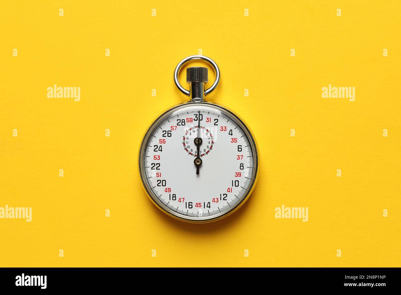 Vintage stopwatch on yellow background, top view Stock Photo - Alamy
