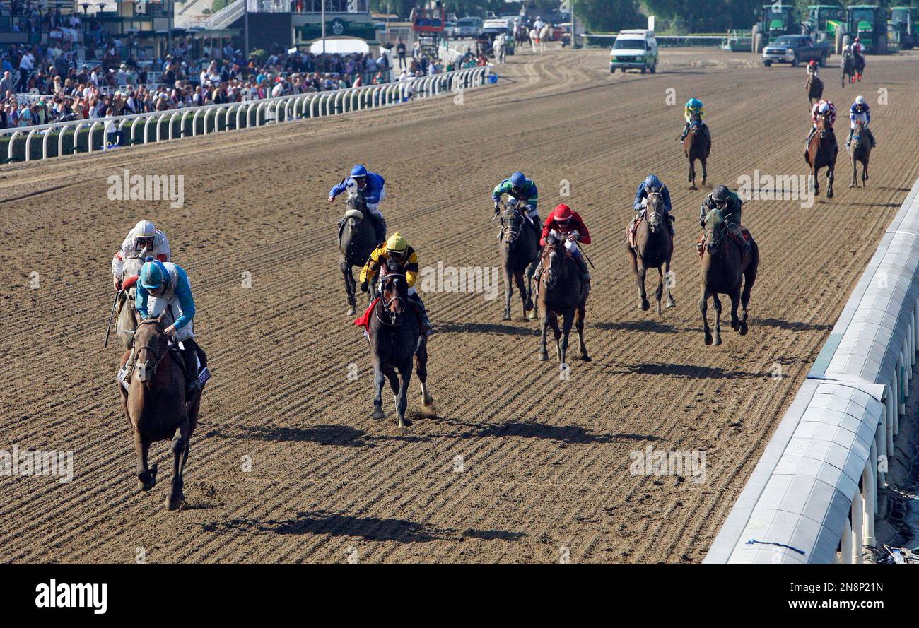 Calidoscopio, left, with Aaron Gryder riding, leads the field across ...