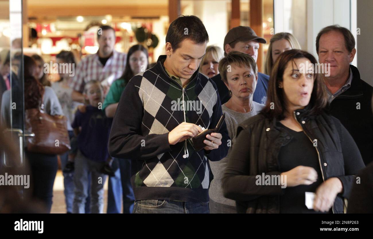 People stand in line to vote at a polling station Friday, Nov. 2, 2012 ...