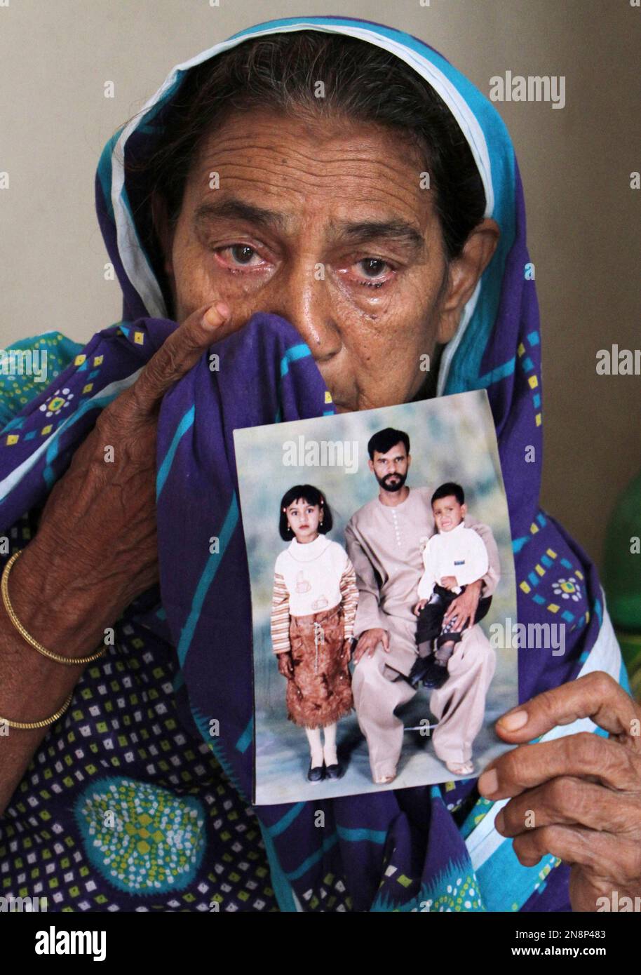 In this Friday, Oct. 19, 2012 photo, Pakistani Aisha Bano, 75, cries ...