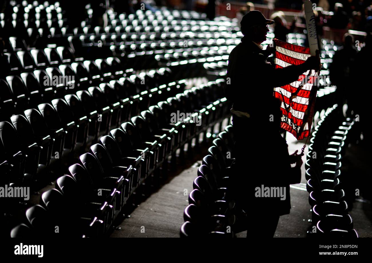 Retired U.S. Navy Cdr. Timothy Persons of Norfolk, Va., holds up a ...