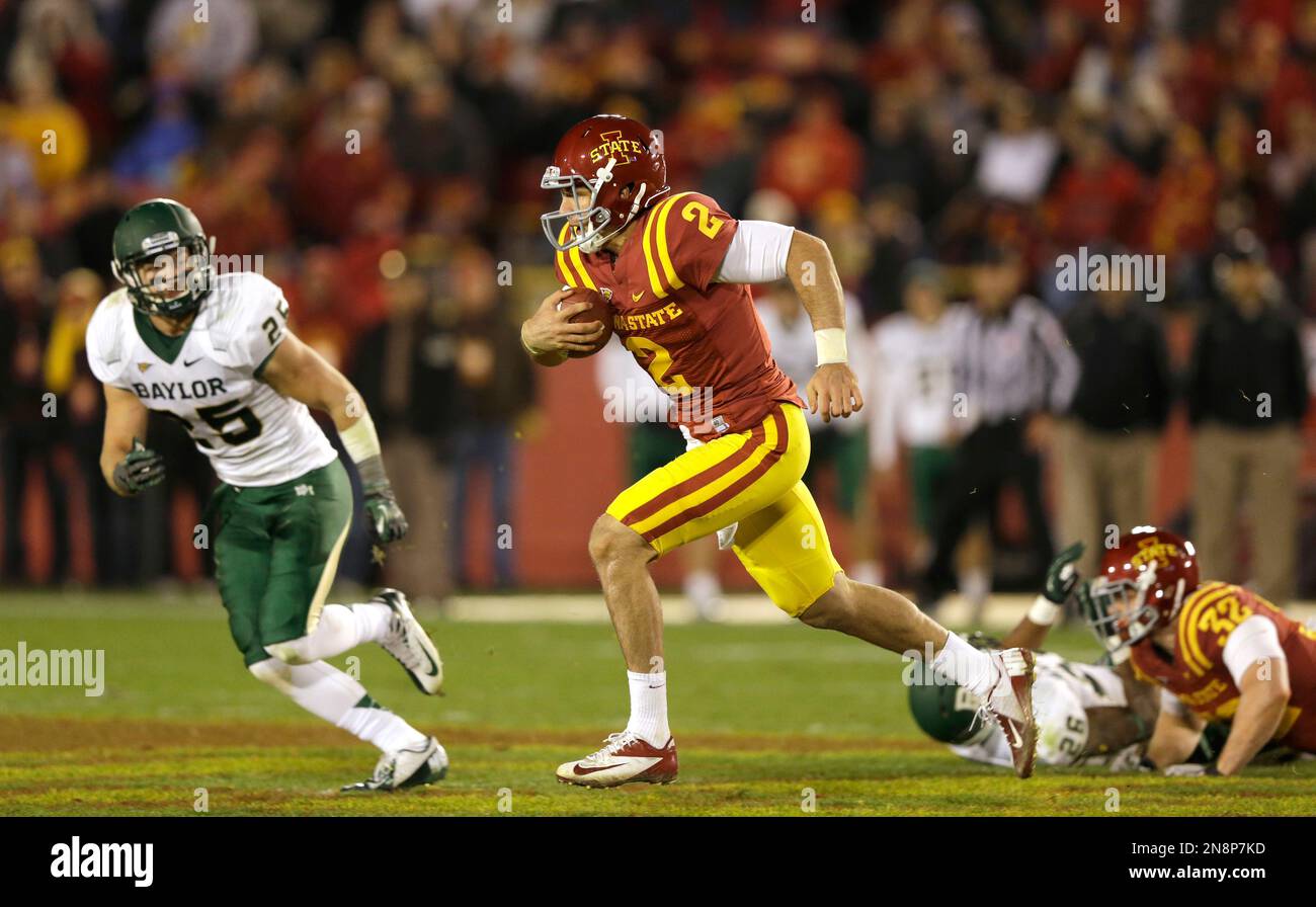 Iowa State quarterback Steele Jantz (2) scrambles for yardage ahead of ...