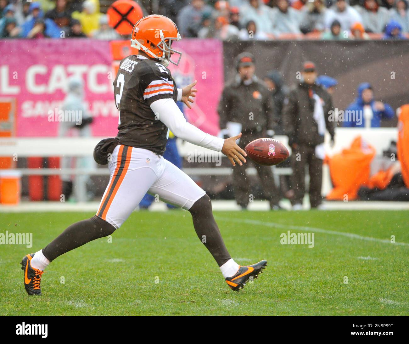 Cleveland Browns punter Reggie Hodges punts during an NFL football game ...